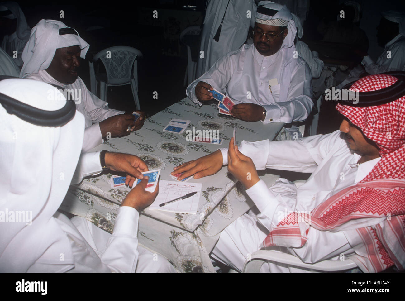 Men friends playing cards during Ramadan in Qatar, 1995 Stock Photo - Alamy