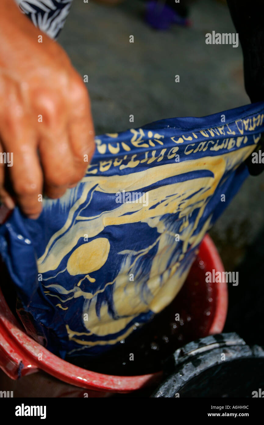 Dyeing and washing out a batik design Cherating Malaysia Stock Photo ...