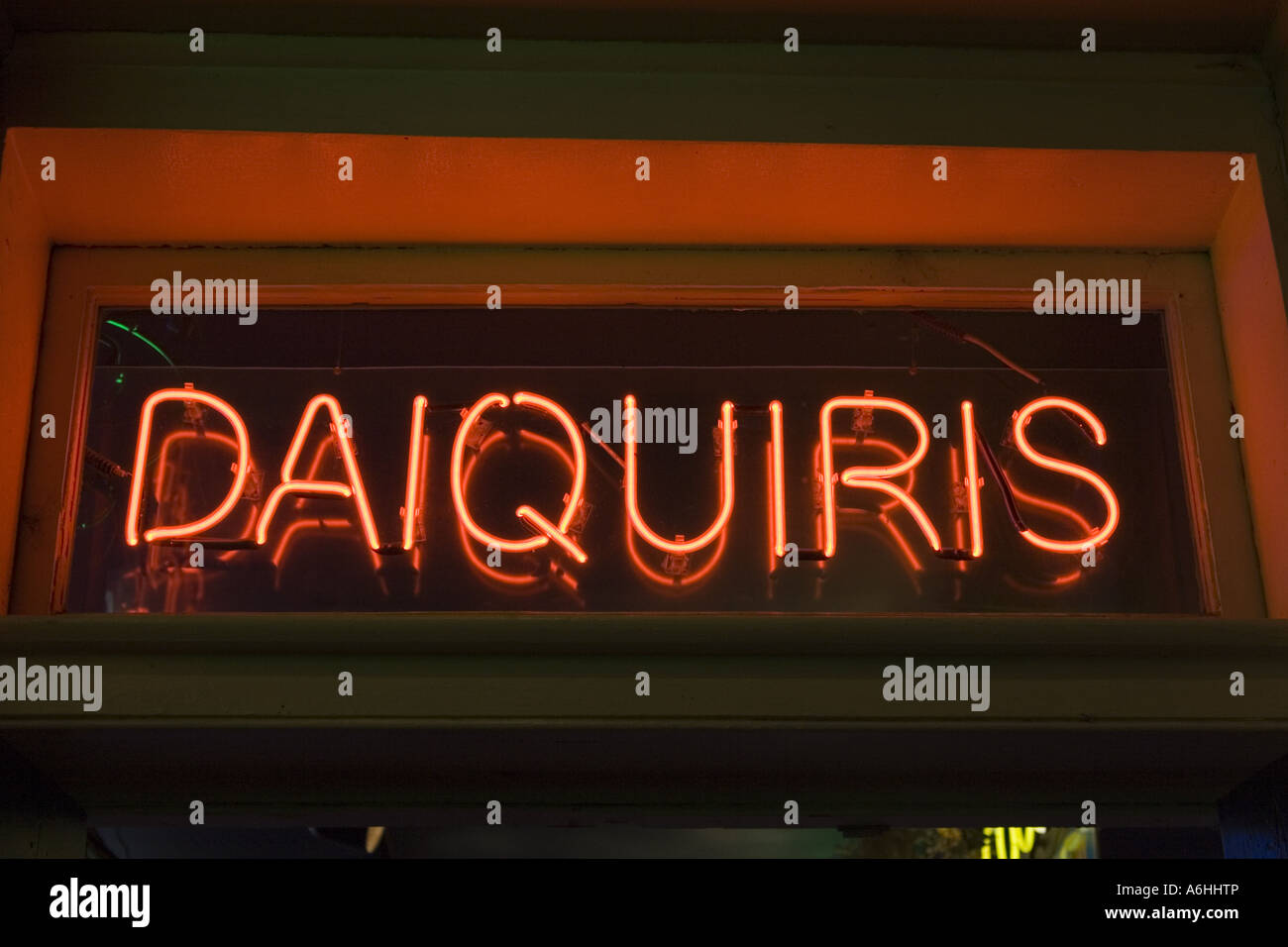 Neon daiquiris sign in doorway of bar Stock Photo - Alamy