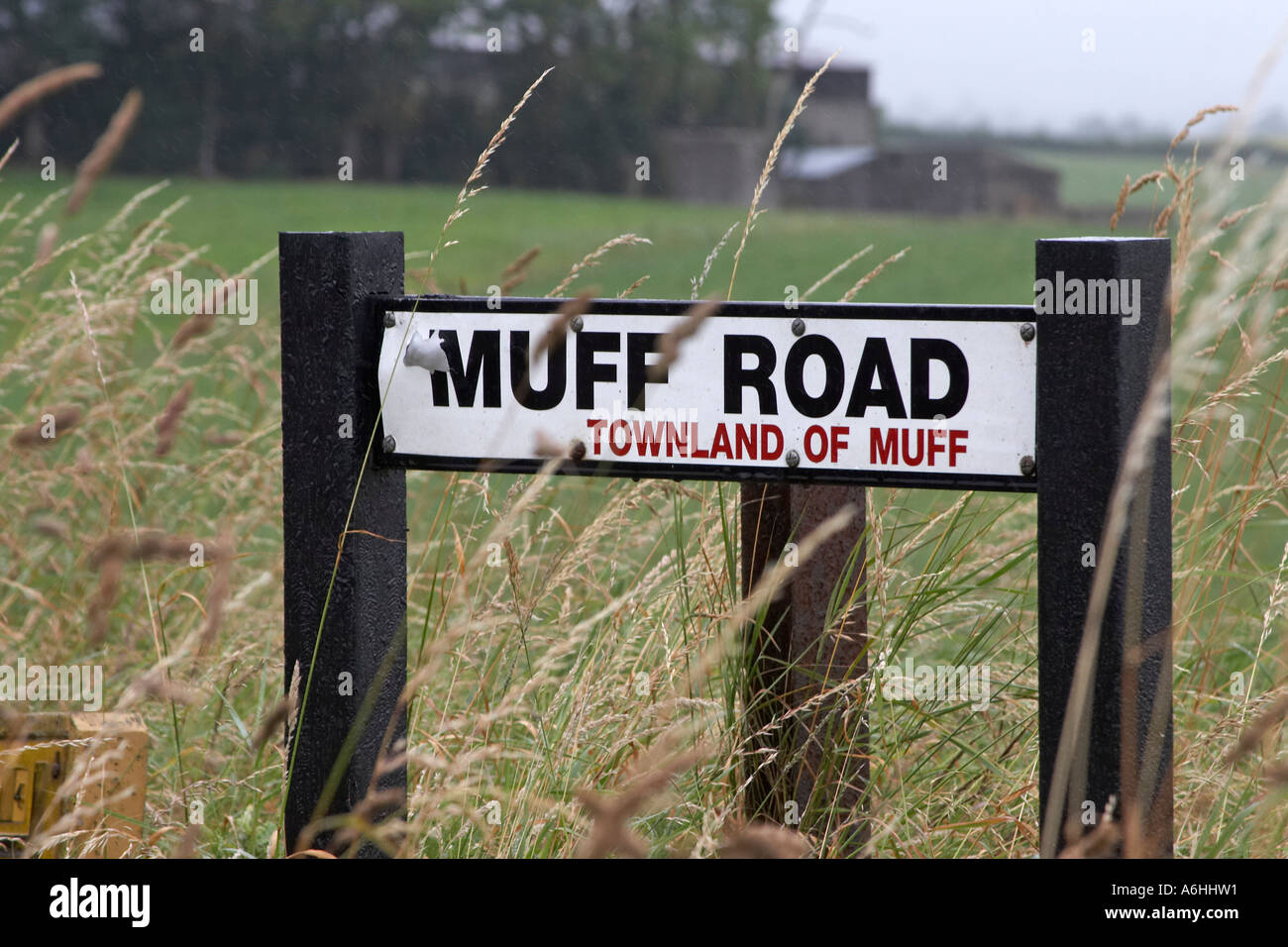 Muff Road in Towland of Muff sign with grass and fields Northern ...