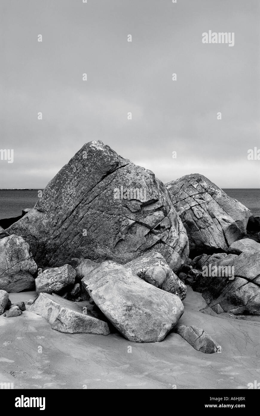 Large collection of weathered rocks on rugged beach Stock Photo - Alamy