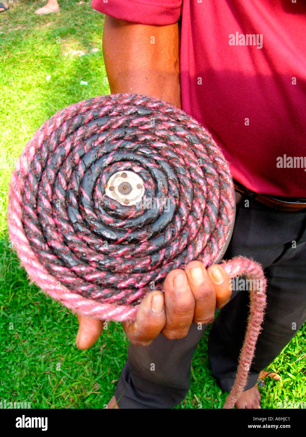 Launch cord wound tightly round heavy spinning top Kota Bharu Malaysia ...