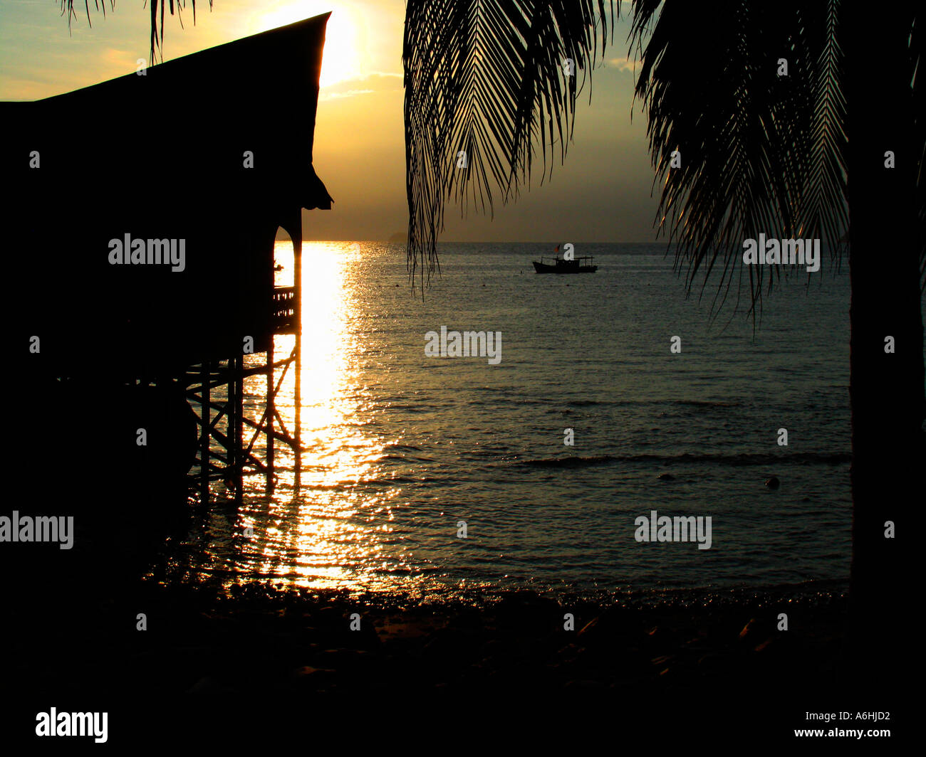 Malaysian style bungalow on stilts at sunset Salang Beach Tioman Island ...