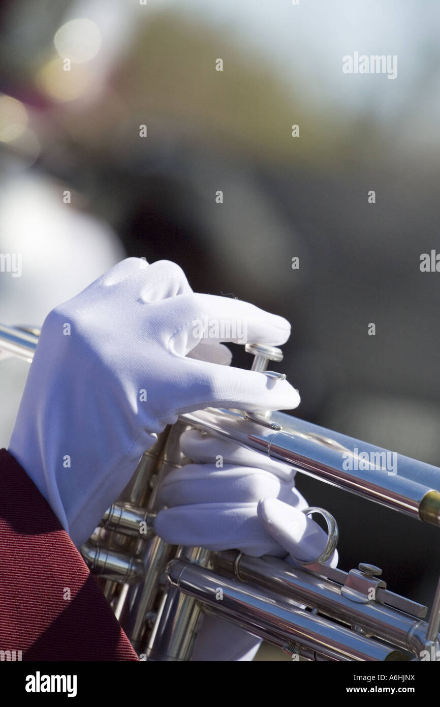 Gloved hand of marching band trumpet player Stock Photo - Alamy
