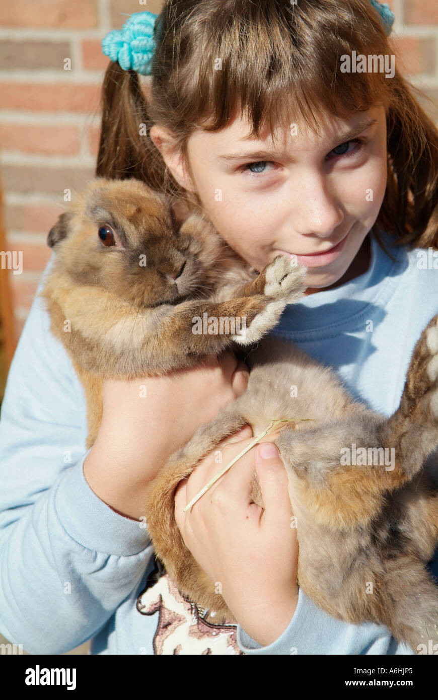 Girl with rabbit Stock Photo - Alamy