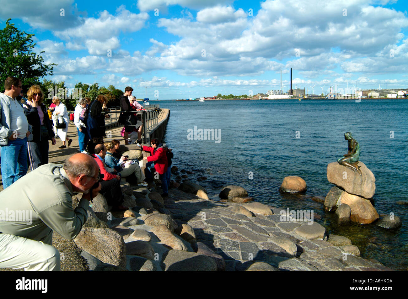 Tourists photographing The Little Mermaid sculpture.Edvard Eriksen (1913).Copenhagen.Denmark ...