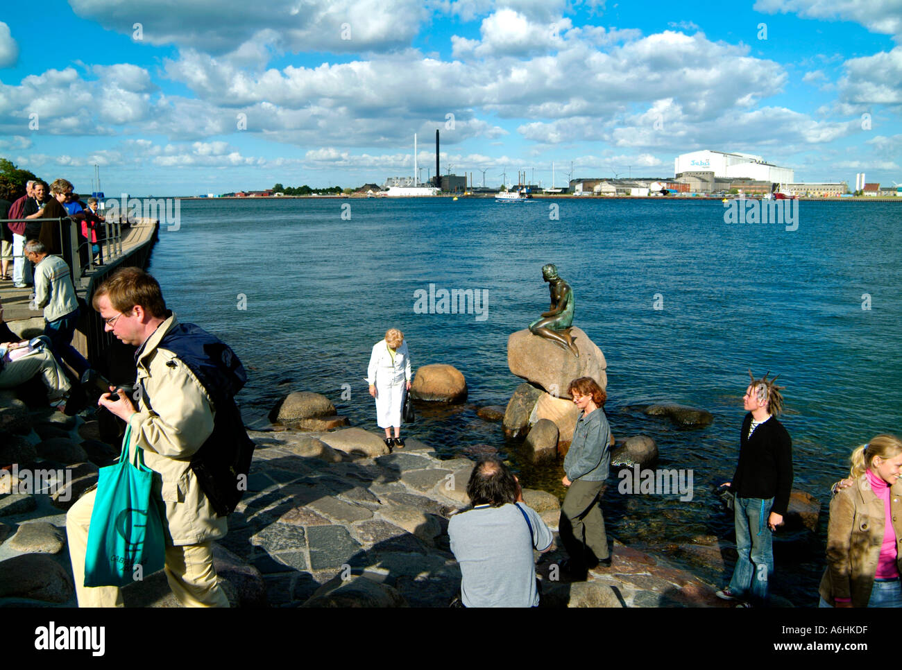 Tourists photographing The Little Mermaid sculpture.Edvard Eriksen (1913).Copenhagen.Denmark ...