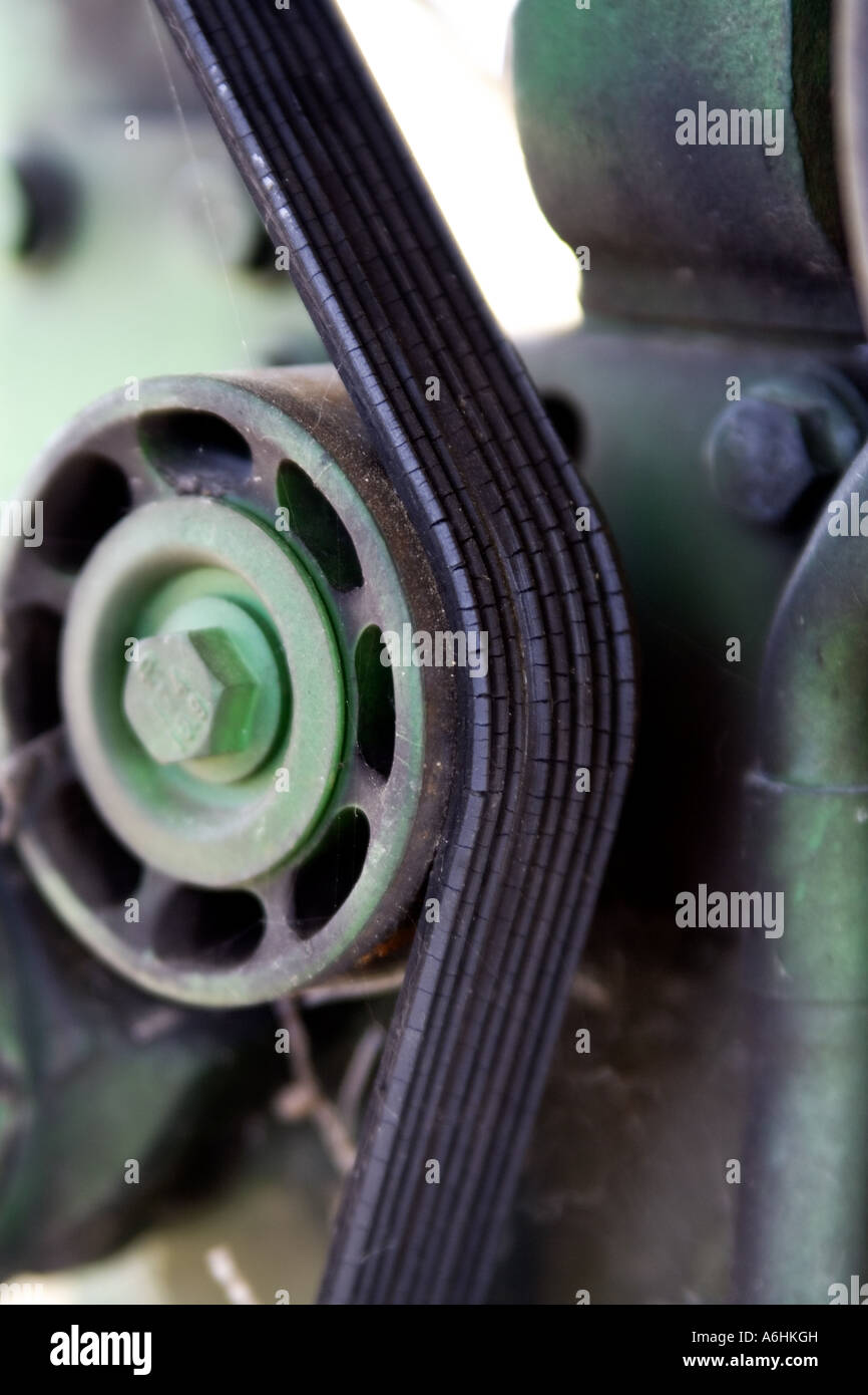 Cracking belt on industrial engine Stock Photo - Alamy