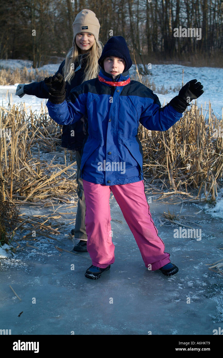 Kids skating on frozen pond hi-res stock photography and images - Alamy