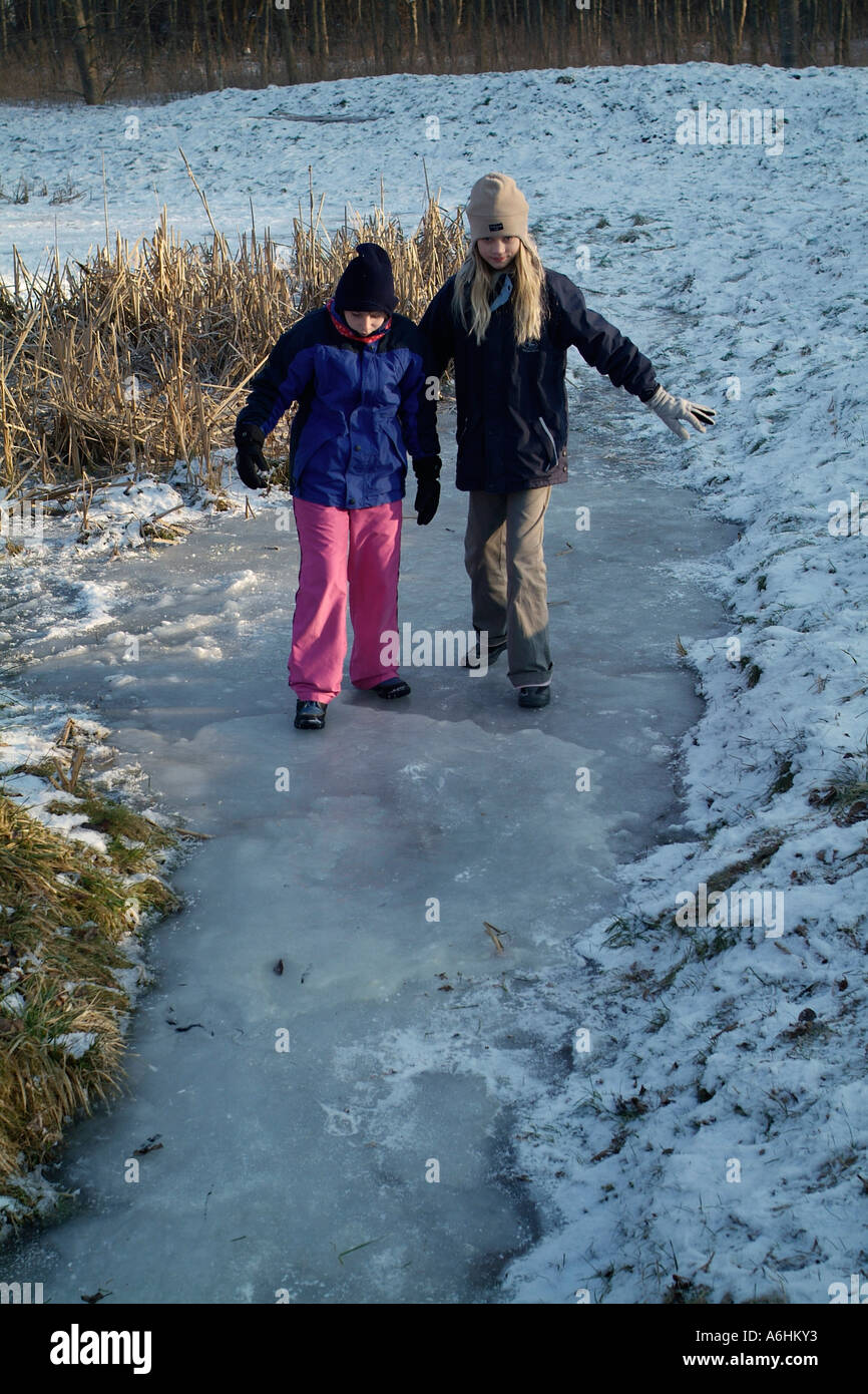 Kids skating on frozen pond hi-res stock photography and images - Alamy