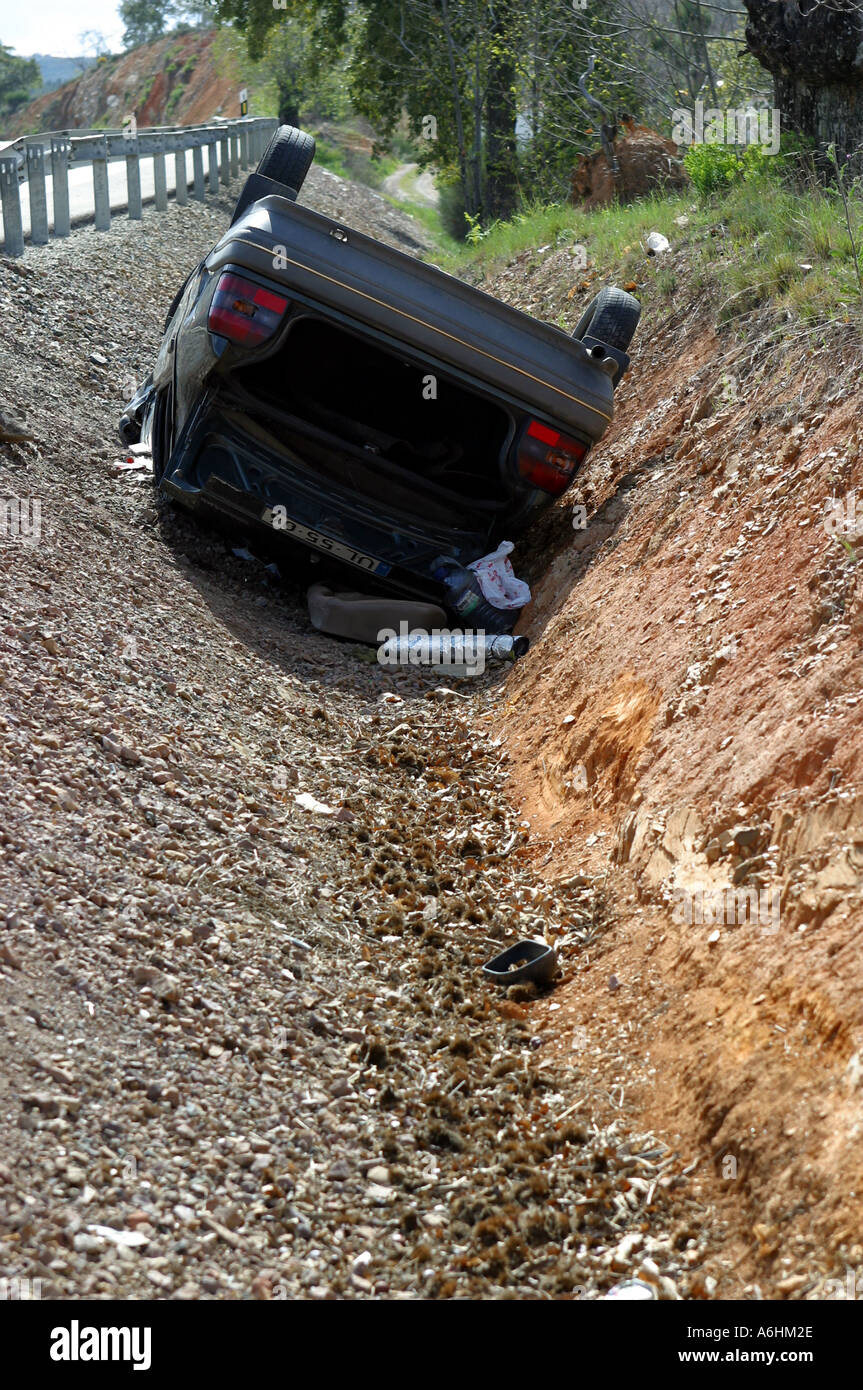 car crash overturned car by the side of the road in spain Stock Photo ...