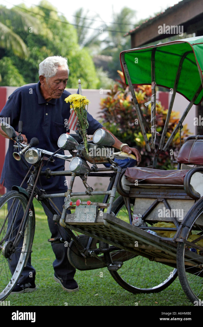 Elderly rickshaw driver Kota Bharu Malaysia Stock Photo - Alamy