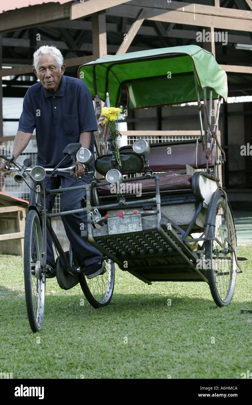 Elderly rickshaw driver Kota Bharu Malaysia Stock Photo - Alamy