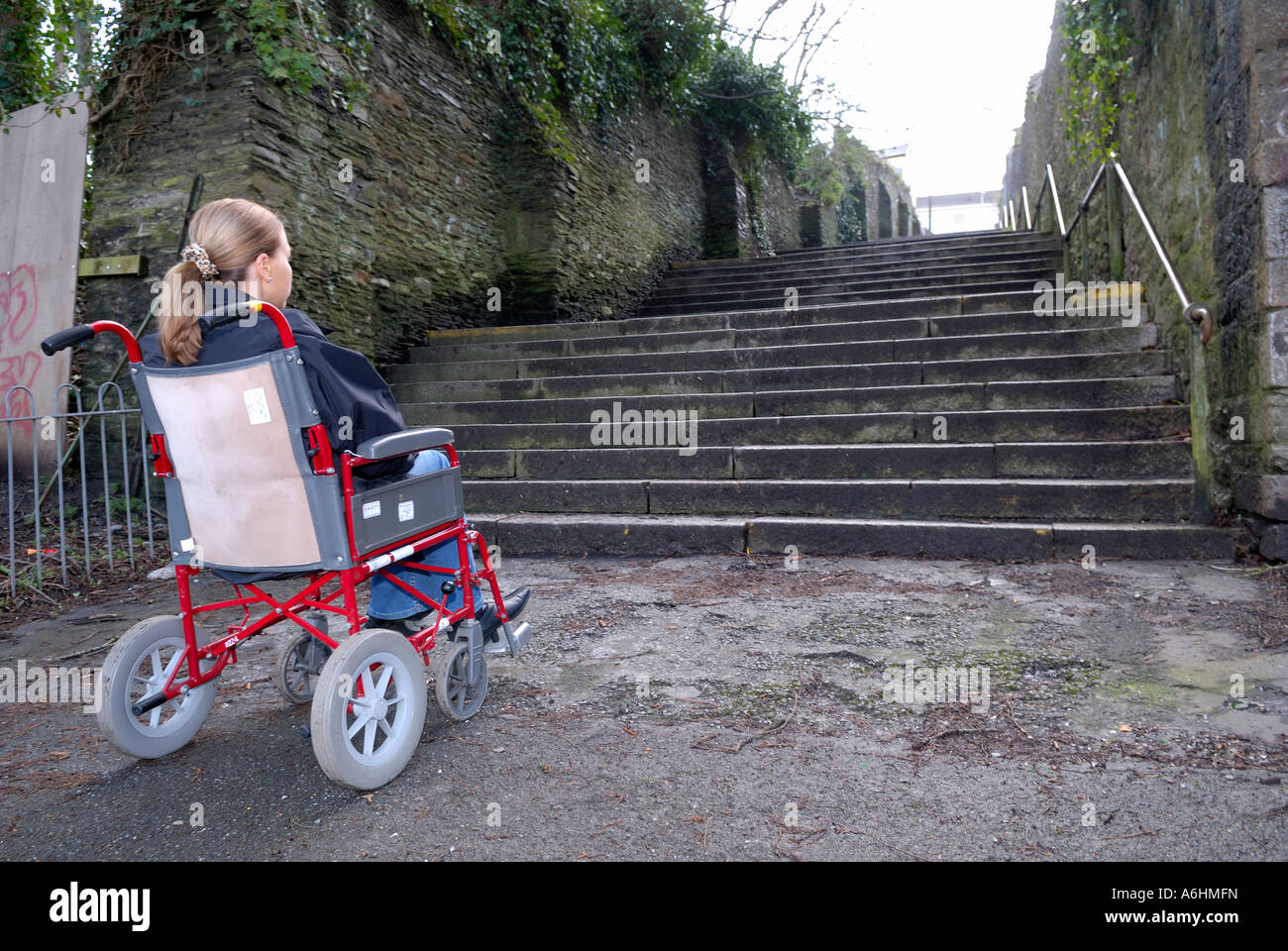 Disabled woman in wheelchair unable to climb large stairway steps Stock ...