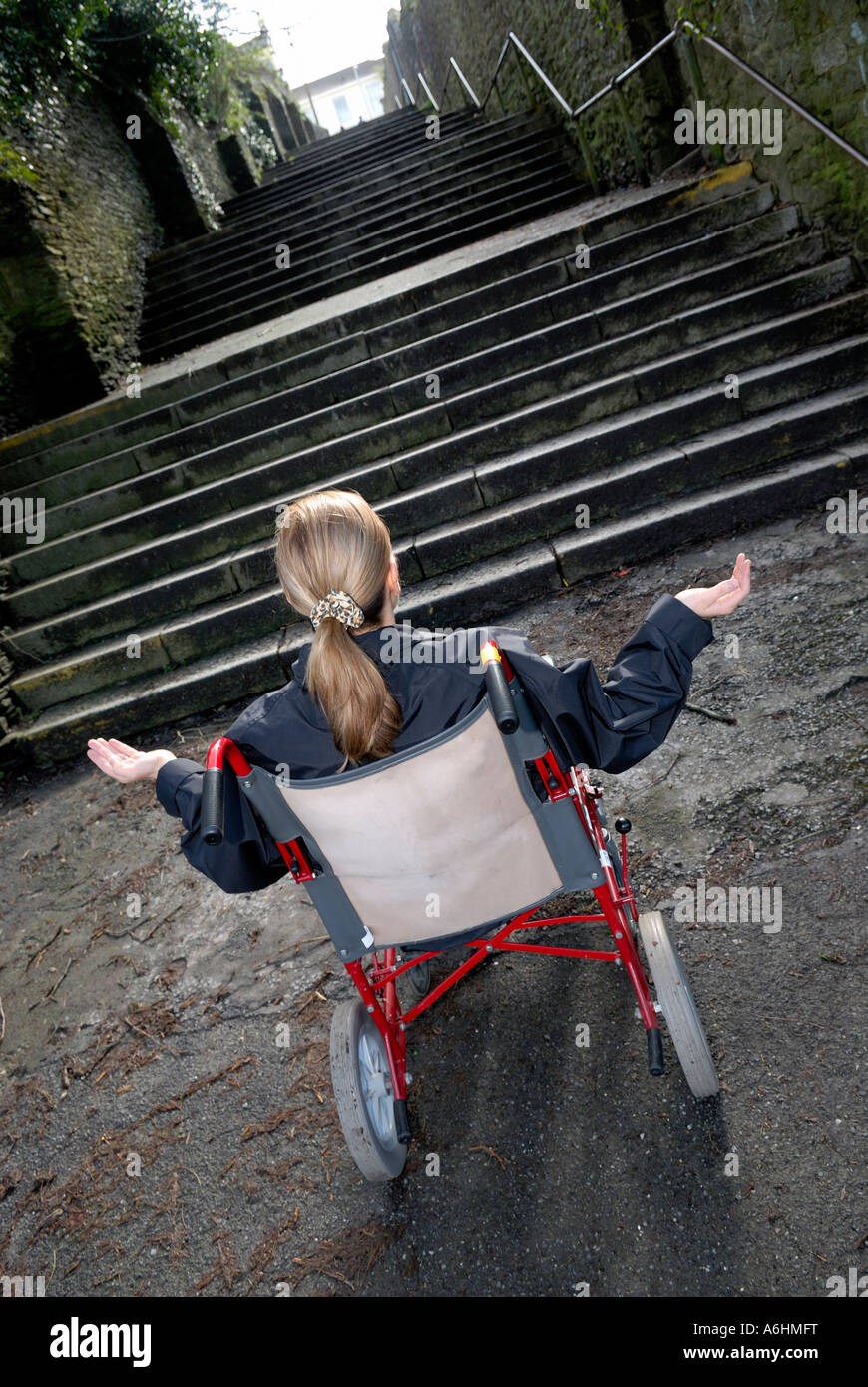 Disabled woman in wheelchair unable to climb large stairway steps Stock ...