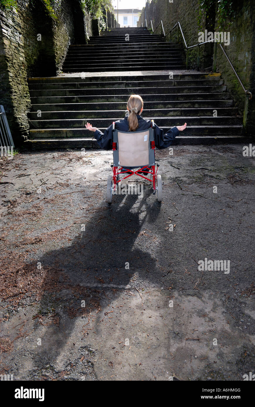 Disabled woman in wheelchair unable to climb large stairway steps Stock ...