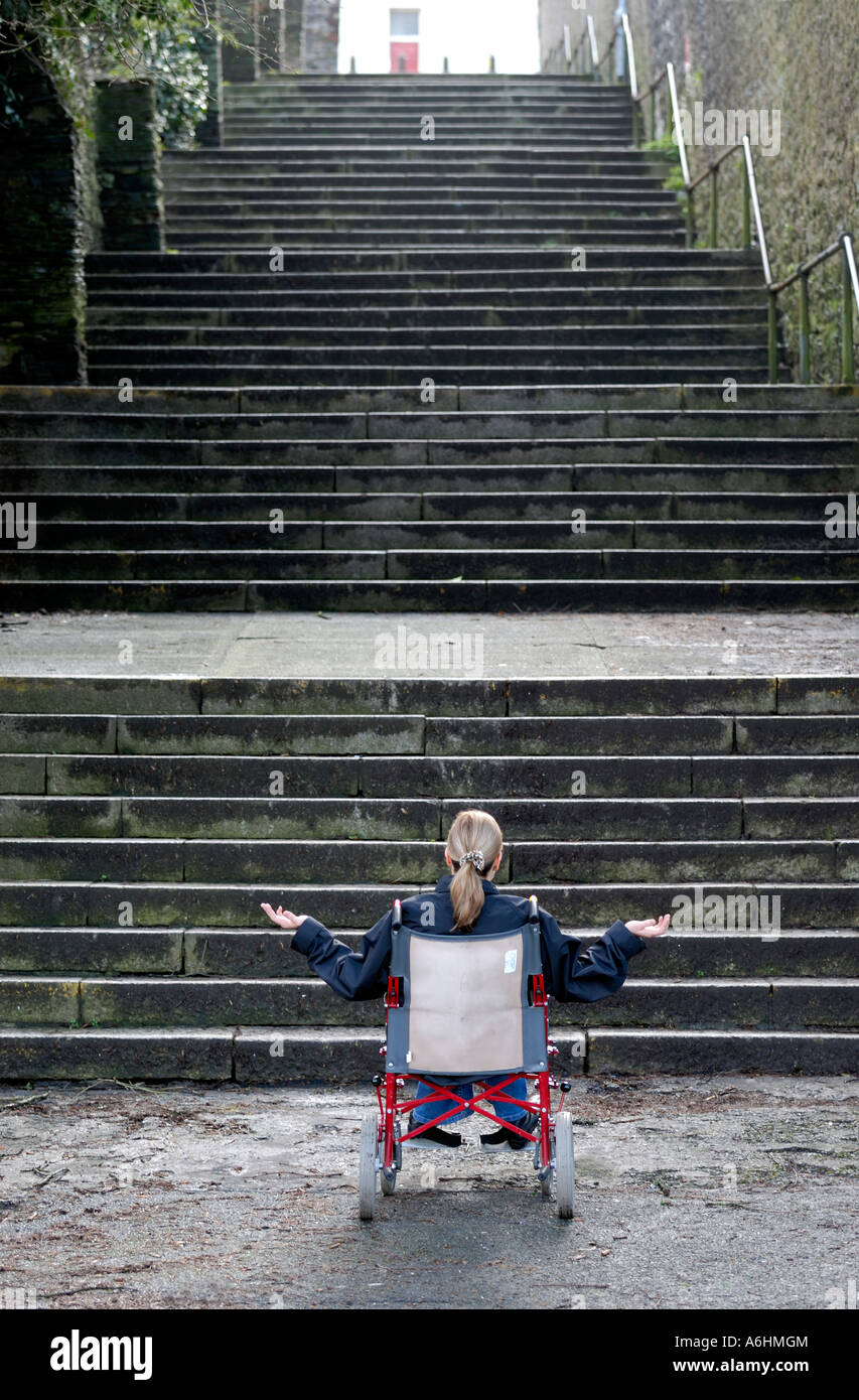 Disabled woman in wheelchair unable to climb large stairway steps Stock ...