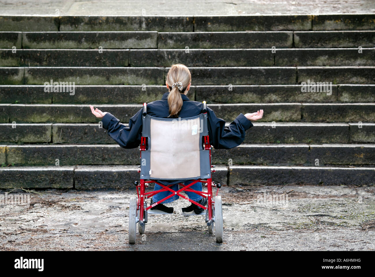 Disabled woman in wheelchair unable to climb large stairway steps Stock ...
