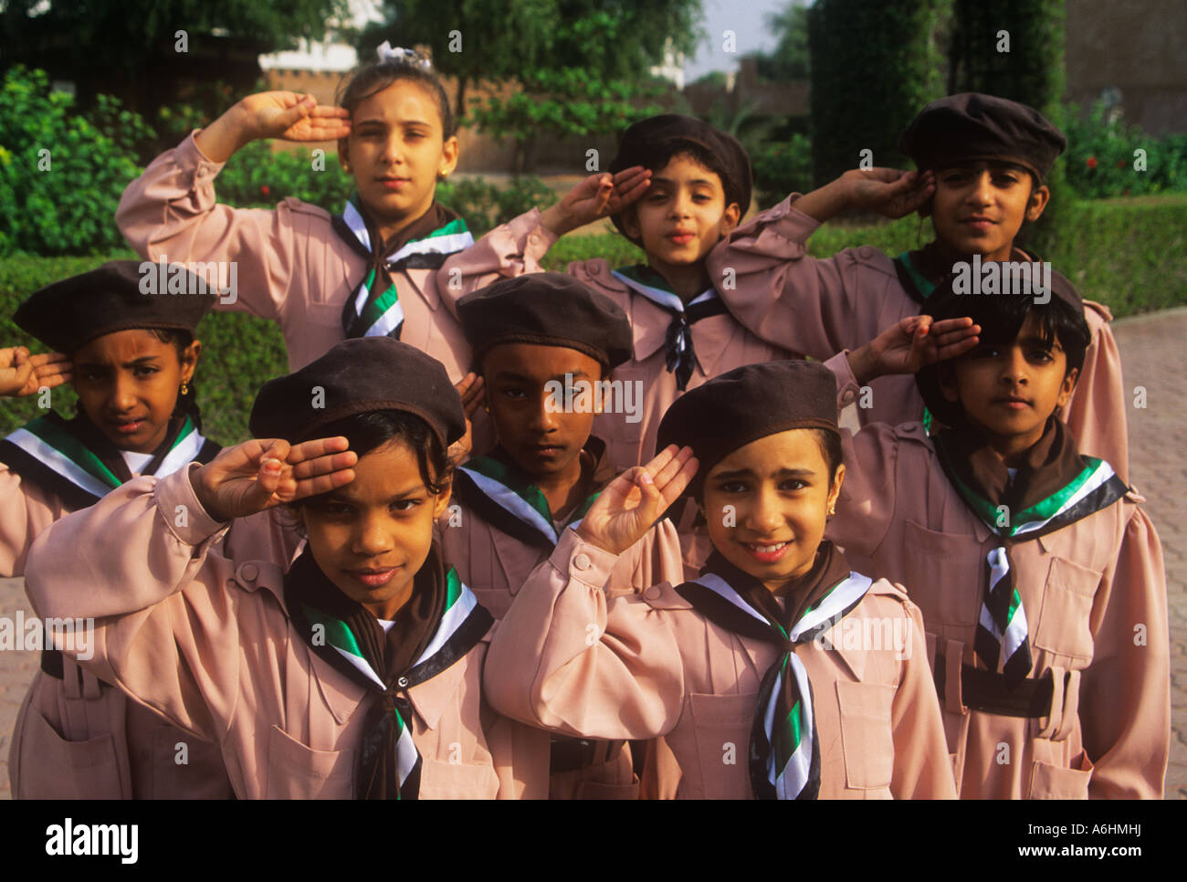 Girl scouts take the salute in the emirate of Ajman UAE Stock Photo - Alamy