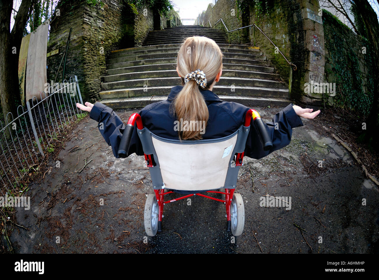 Disabled woman in wheelchair unable to climb large stairway steps Stock ...