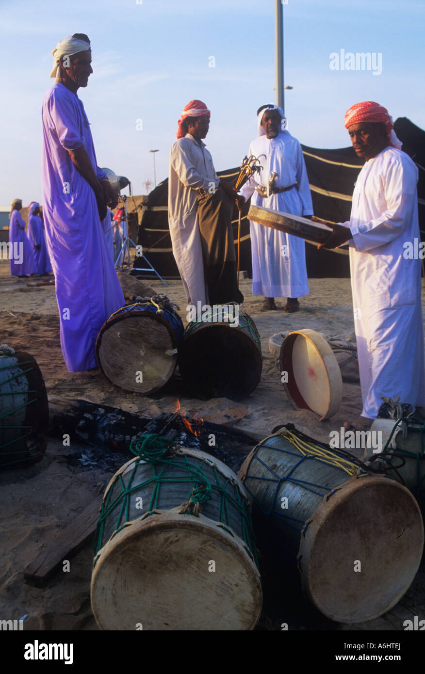 Emirati musicians warm their camelskin drums Abu Dhabi Stock Photo - Alamy