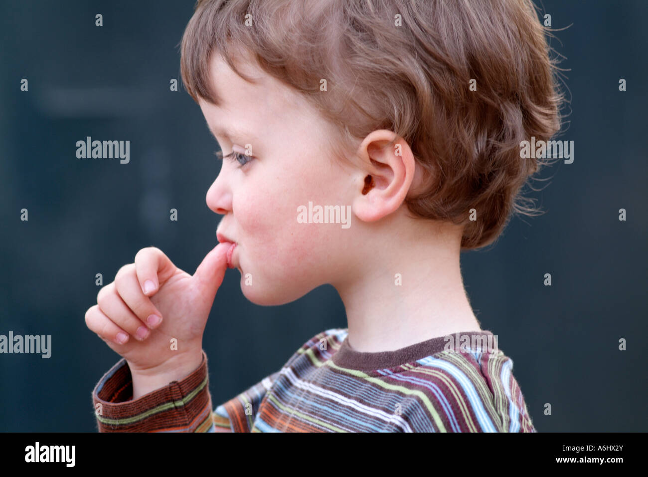 Small boy sucking thumb Stock Photo - Alamy