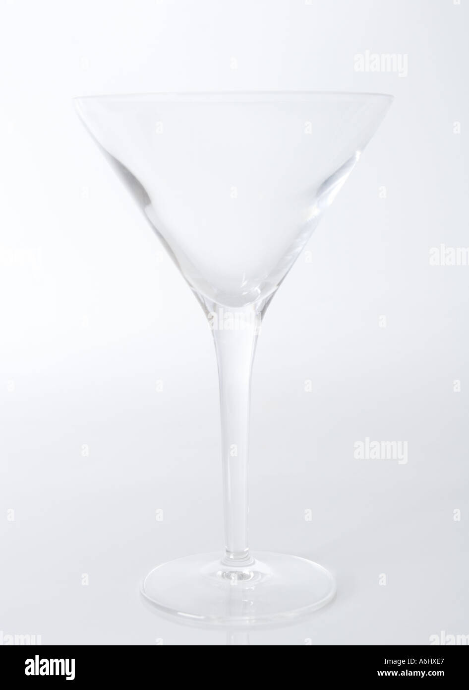 Empty martini glass high key image on white background Stock Photo - Alamy