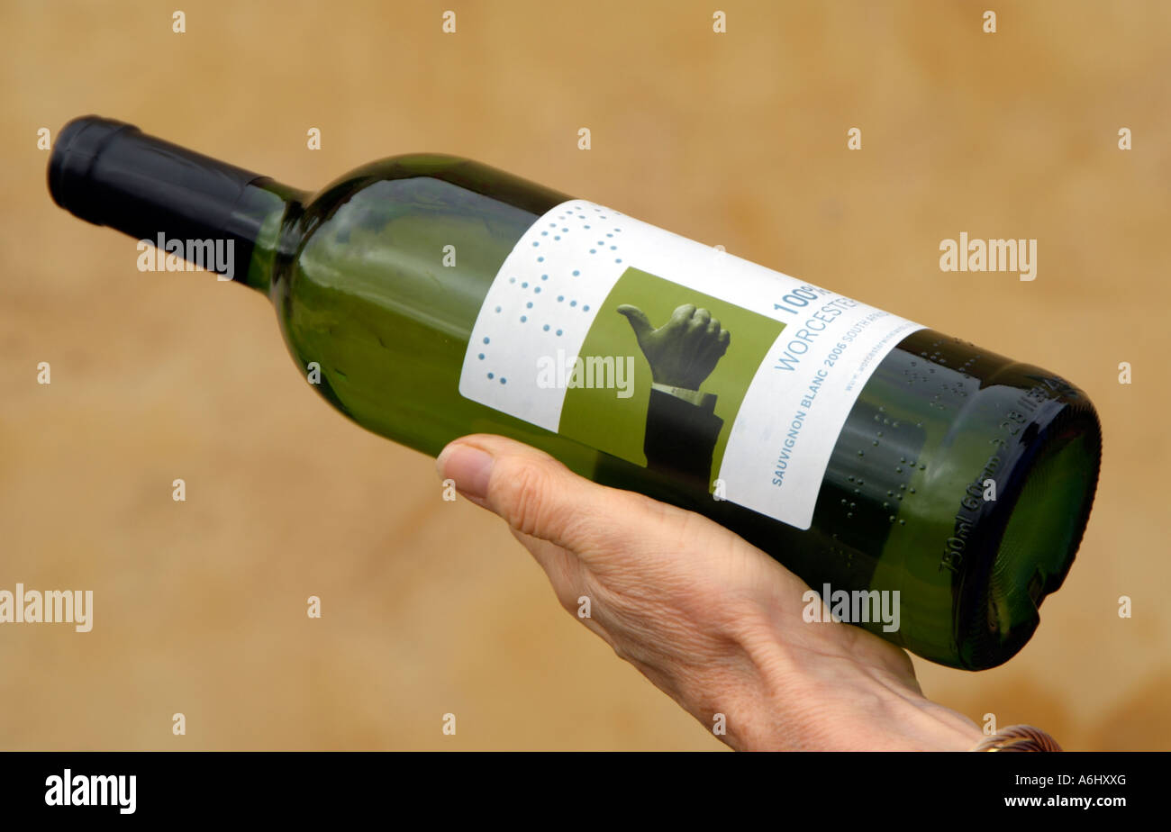 Reading Braille Raised writing on a wine bottle and label for use by ...