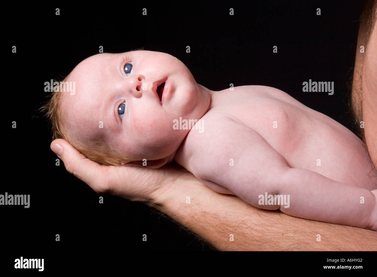Baby on hand Stock Photo - Alamy