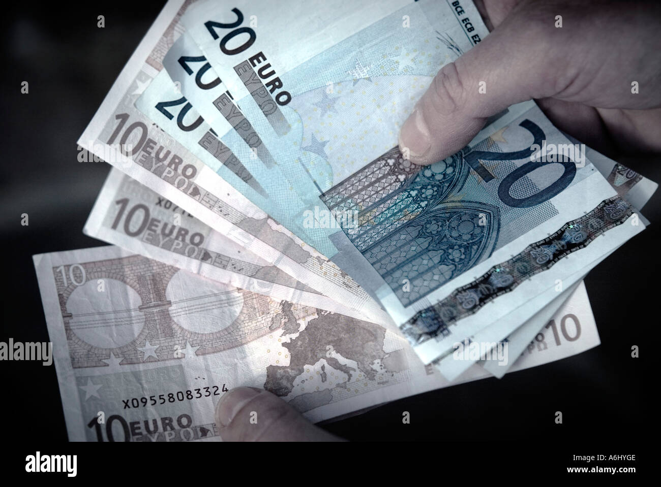 Euro banknote in hand Stock Photo - Alamy