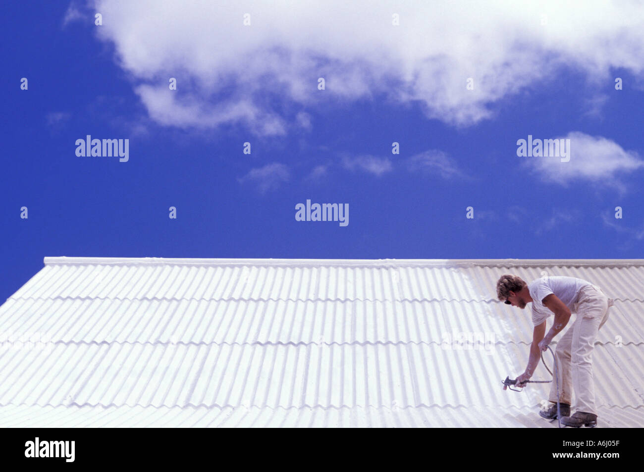 Man hammering on roof hi-res stock photography and images - Alamy