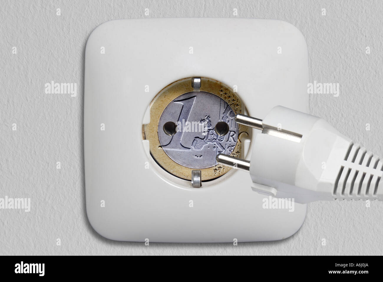 Wall socket and plug, euro coin Stock Photo - Alamy
