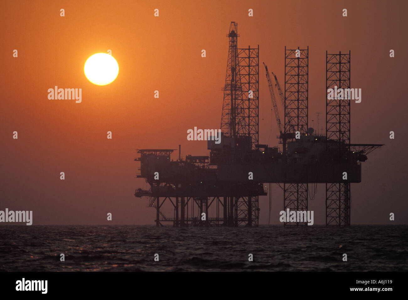 Oil Rig at Sunset Stock Photo - Alamy