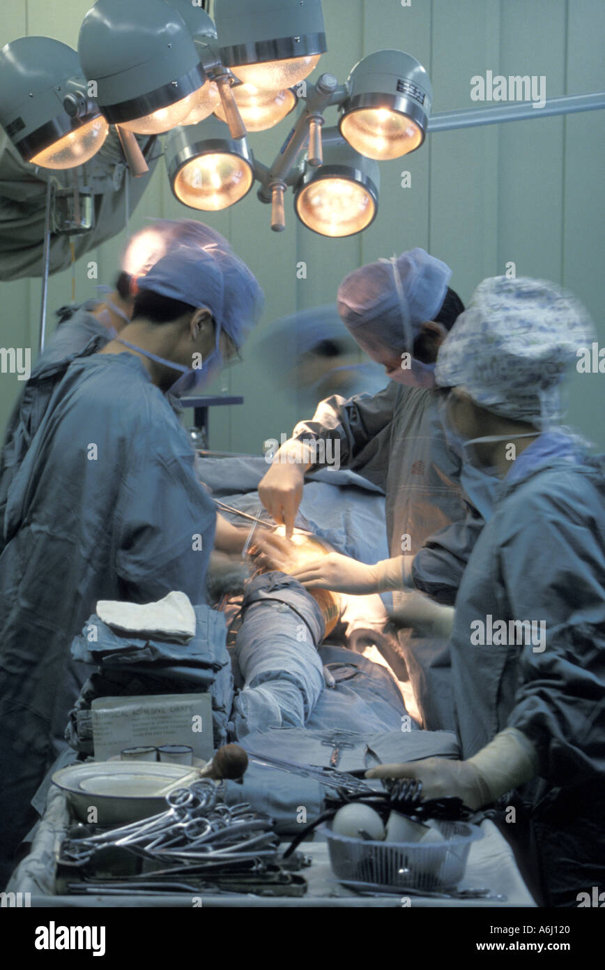 Doctors Performing Surgery Stock Photo - Alamy