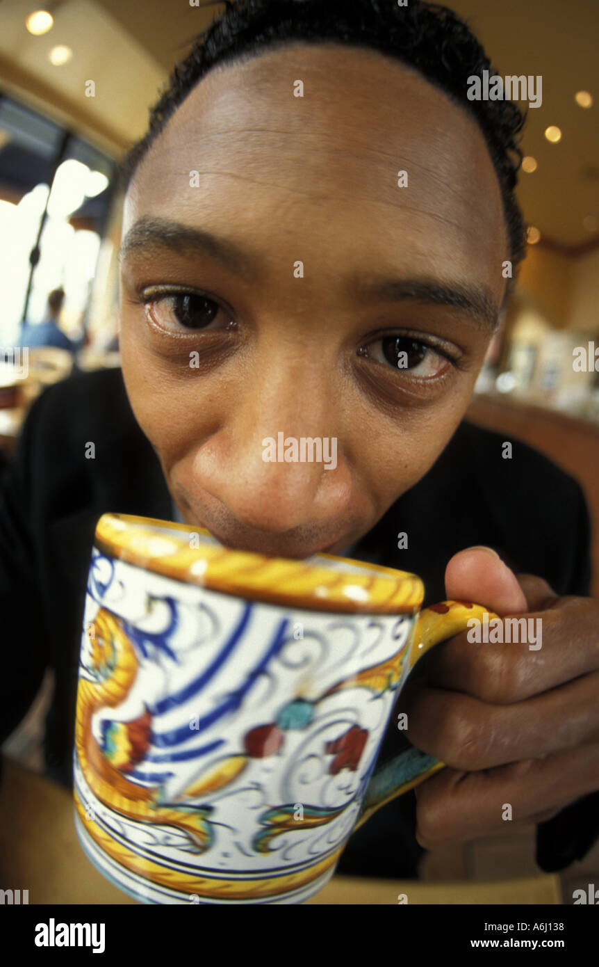 Man Drinking Coffee in Fish Eye Lens Stock Photo - Alamy