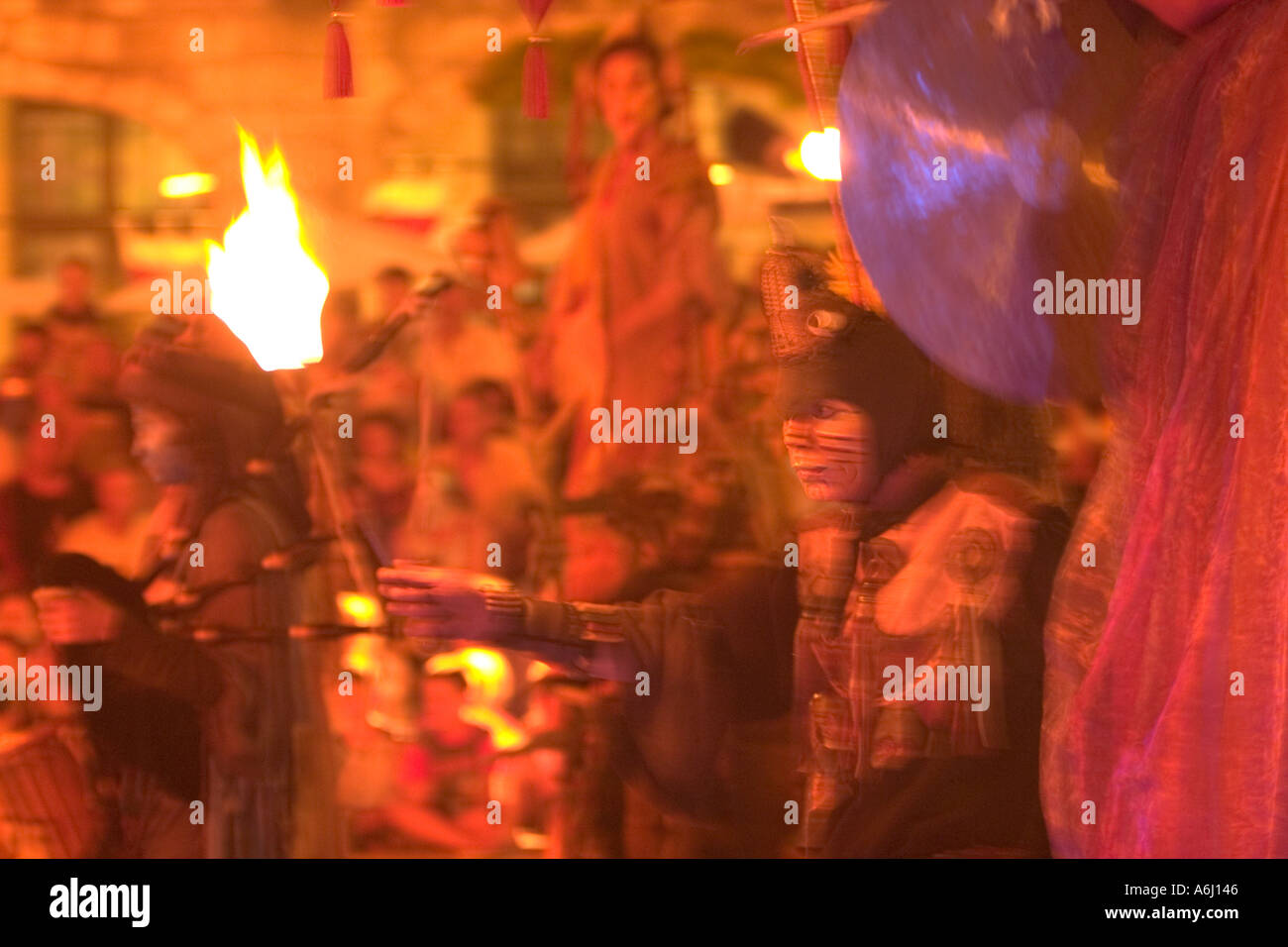 Fire dancers in red light and blurred action at french medieval ...