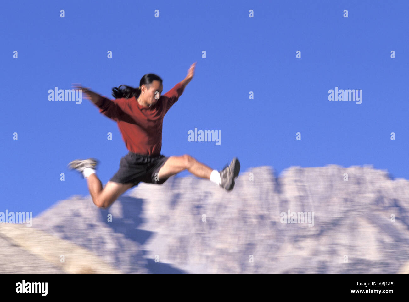 Man Jumping In the Air Stock Photo - Alamy