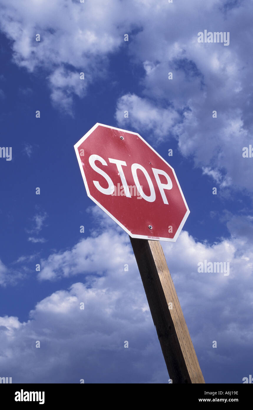 Stop Sign and Blue Sky with Clouds Stock Photo - Alamy