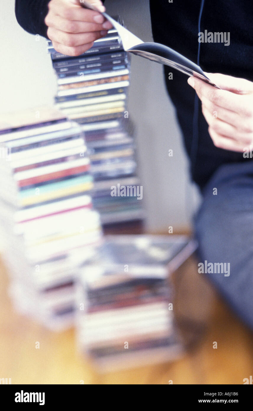 Person Listening to CD Collection Stock Photo - Alamy