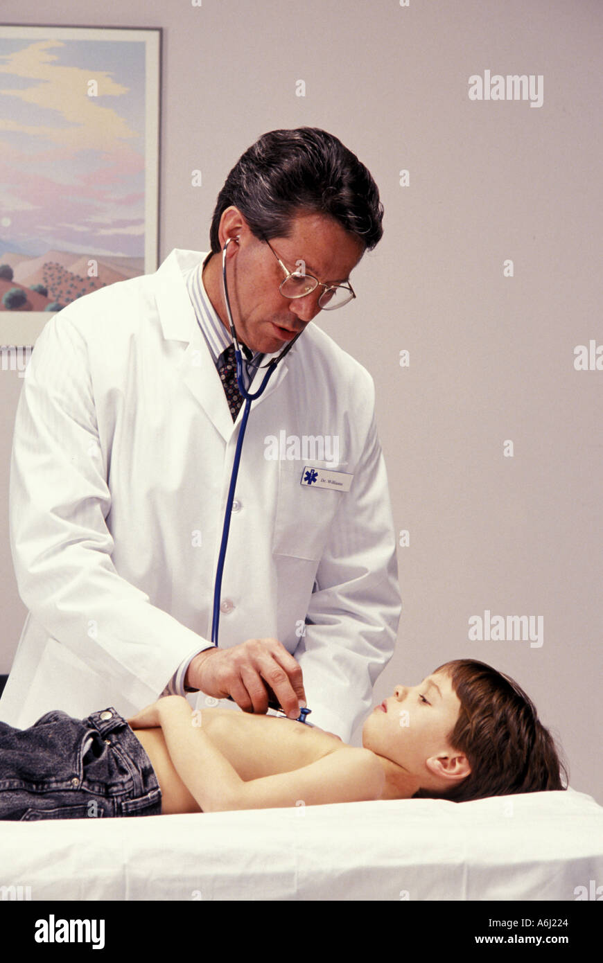 Doctor Listening to Little Boy s Heart Stock Photo - Alamy