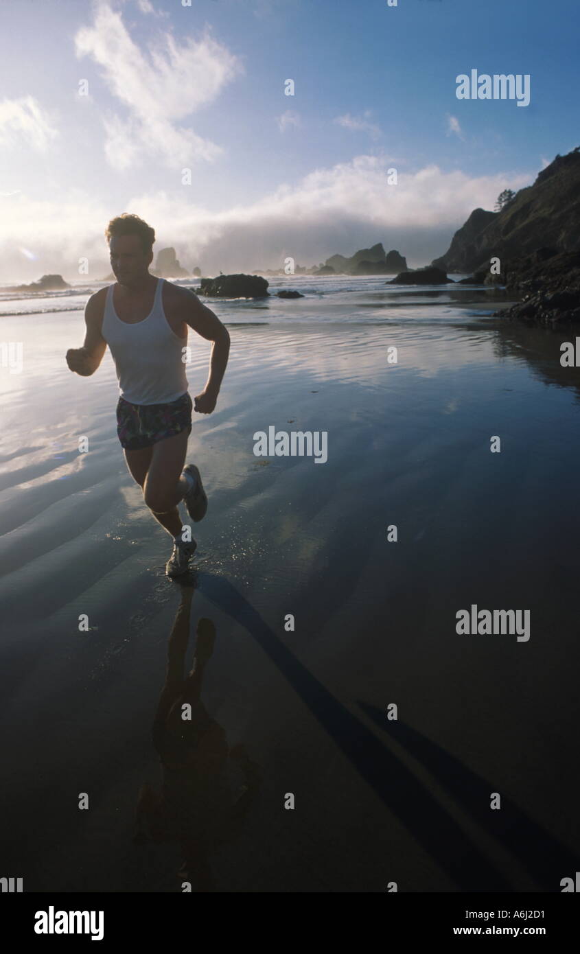 Runner on the Beach Stock Photo - Alamy