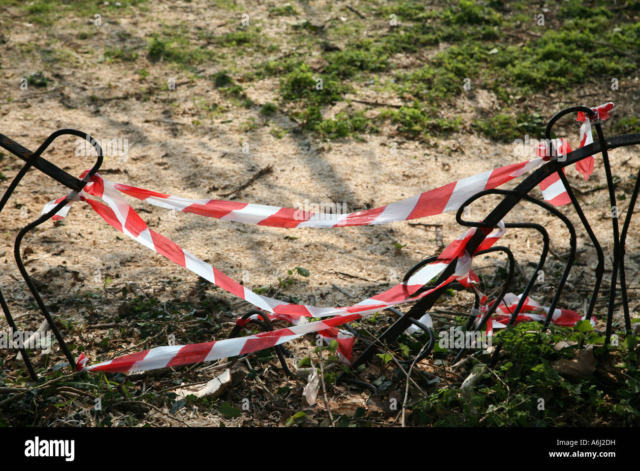 a damaged fence with danger take preventing people from passing through ...