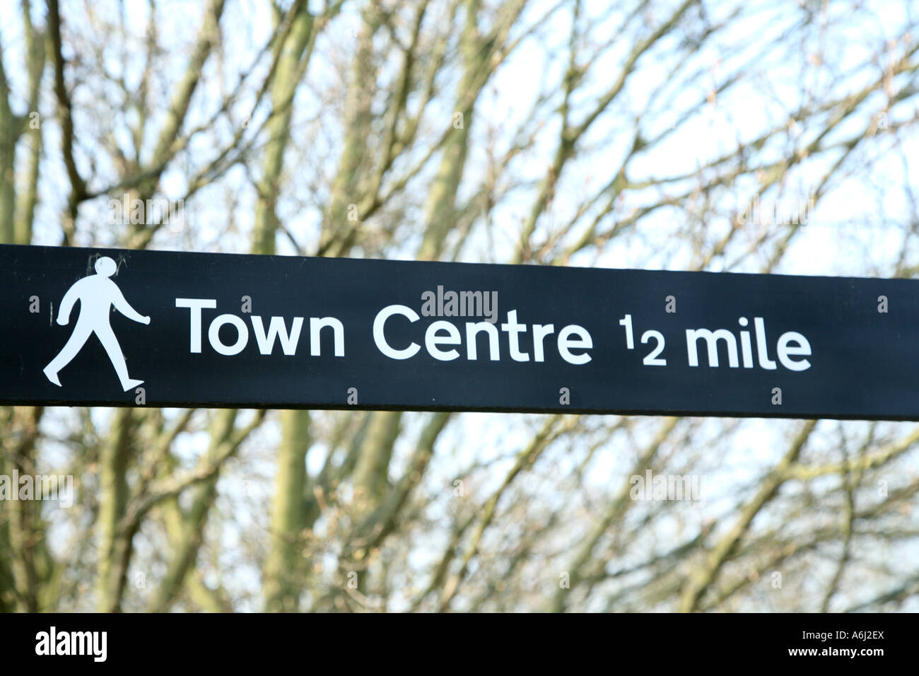 town center one half a mile sign post Stock Photo - Alamy
