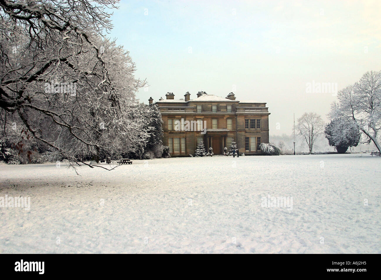 Country manor house in snow covered parkland Stock Photo - Alamy