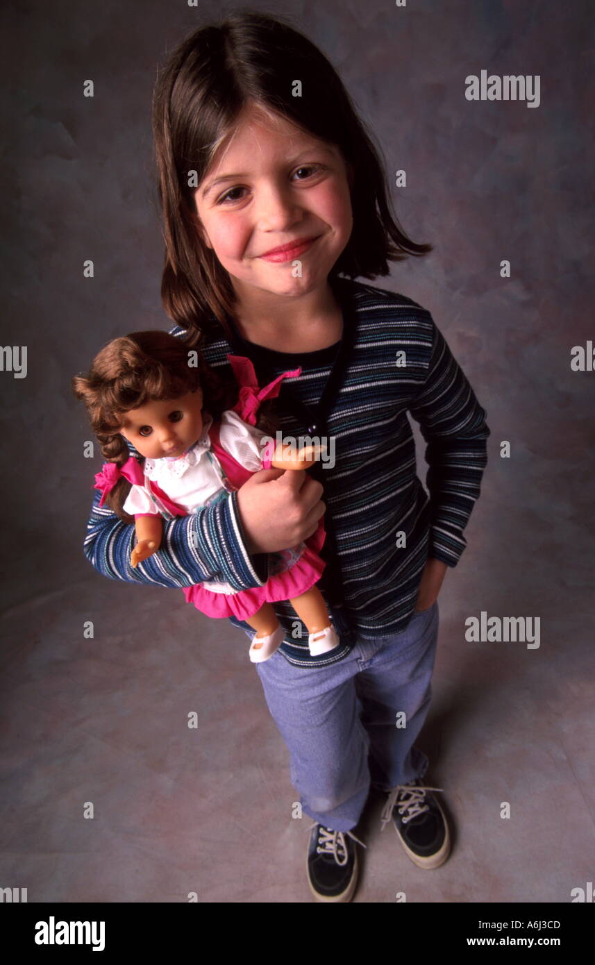 Child clutching doll hi-res stock photography and images - Alamy