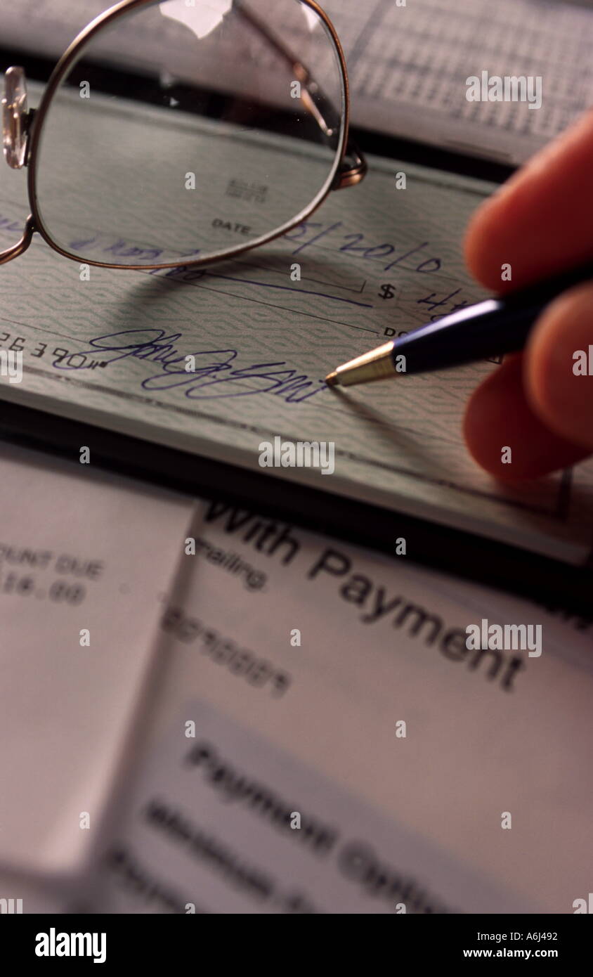 Writing A Check Stock Photo - Alamy