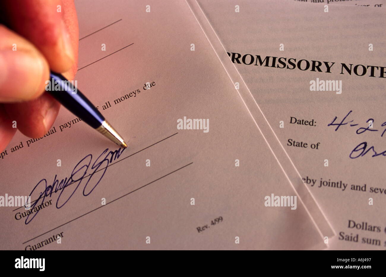 Signing A Document Stock Photo - Alamy