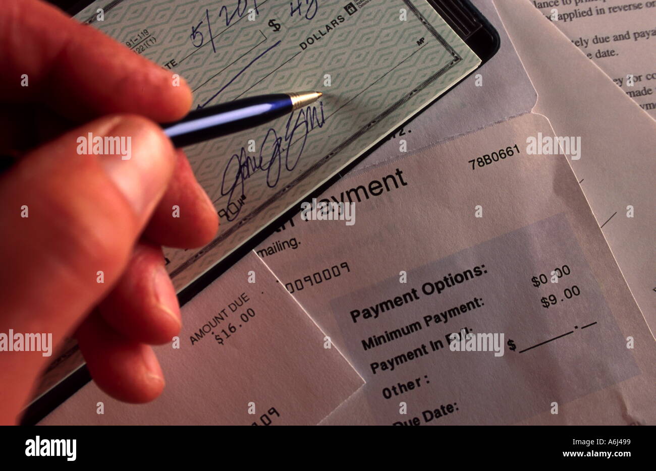 Signing A Check Stock Photo - Alamy