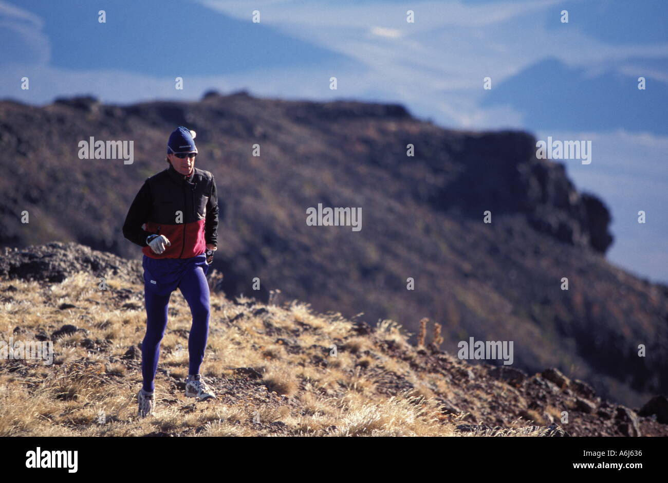 Man Running on High Ridge Stock Photo - Alamy