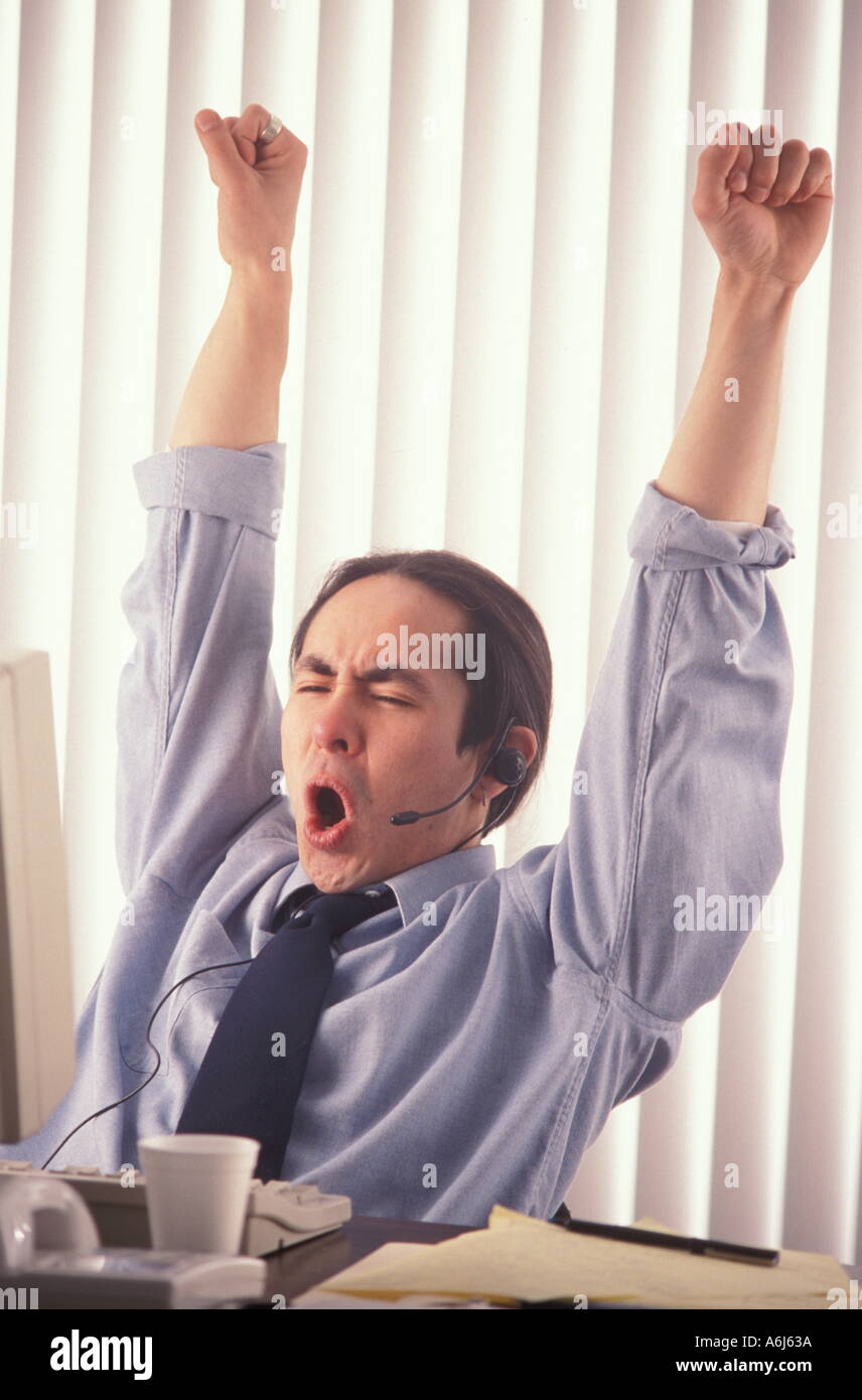 Asian businessman tired yawning working hi-res stock photography and ...